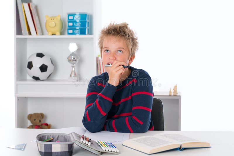 Boy is doing homework stock image. Image of education - 43646163