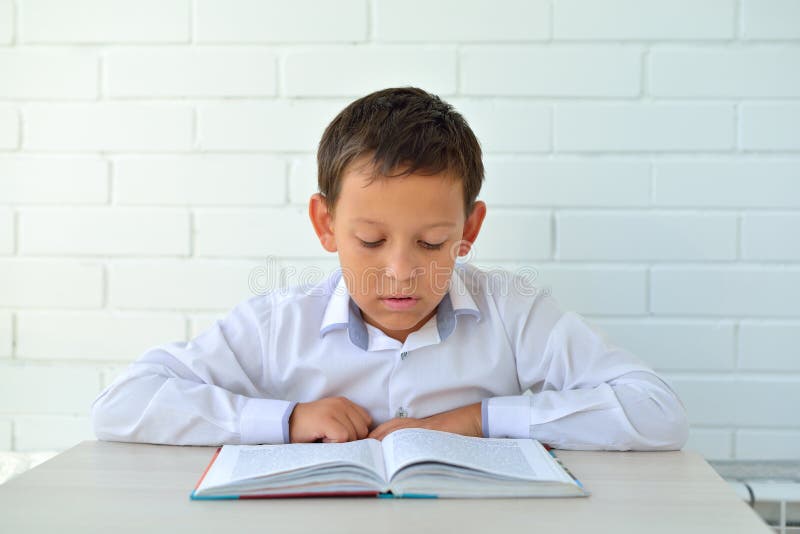 Boy doing homework stock image. Image of lessons, studying - 144162463