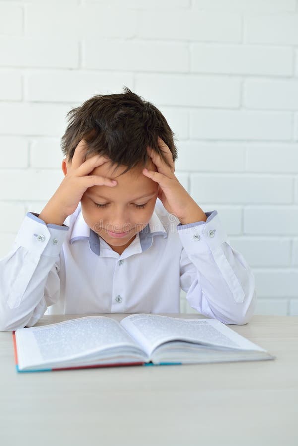 Boy doing homework stock image. Image of childhood, learning - 159143119