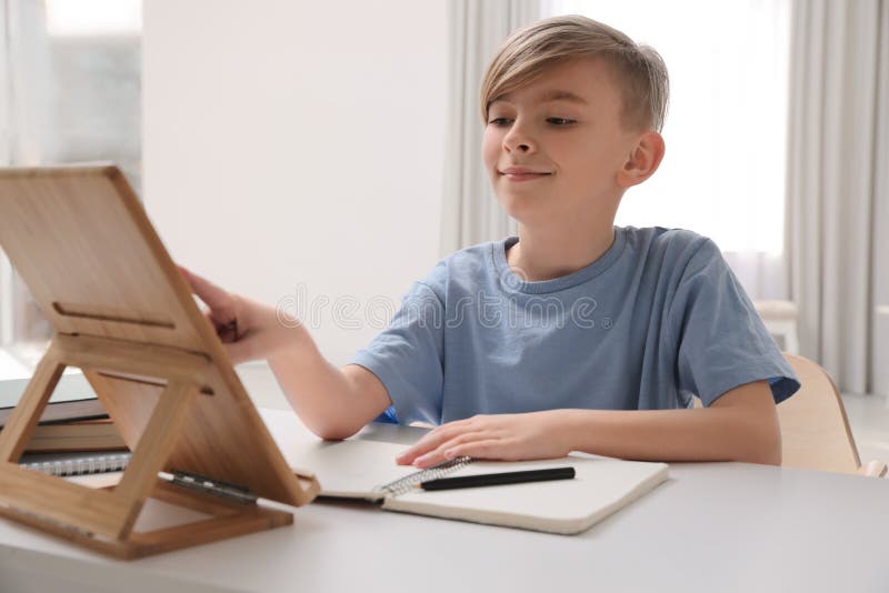Boy Doing Homework with Tablet at Table Stock Image - Image of happy ...