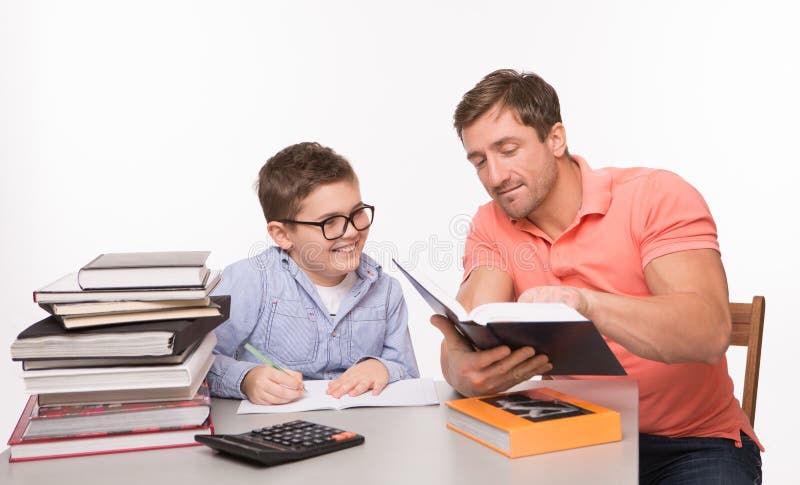 Boy Doing Homework Together with His Father Stock Photo - Image of ...