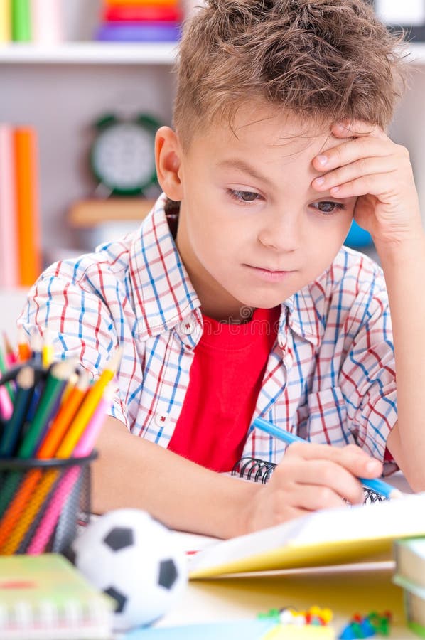 Boy doing homework stock photo. Image of junior, class - 85911664