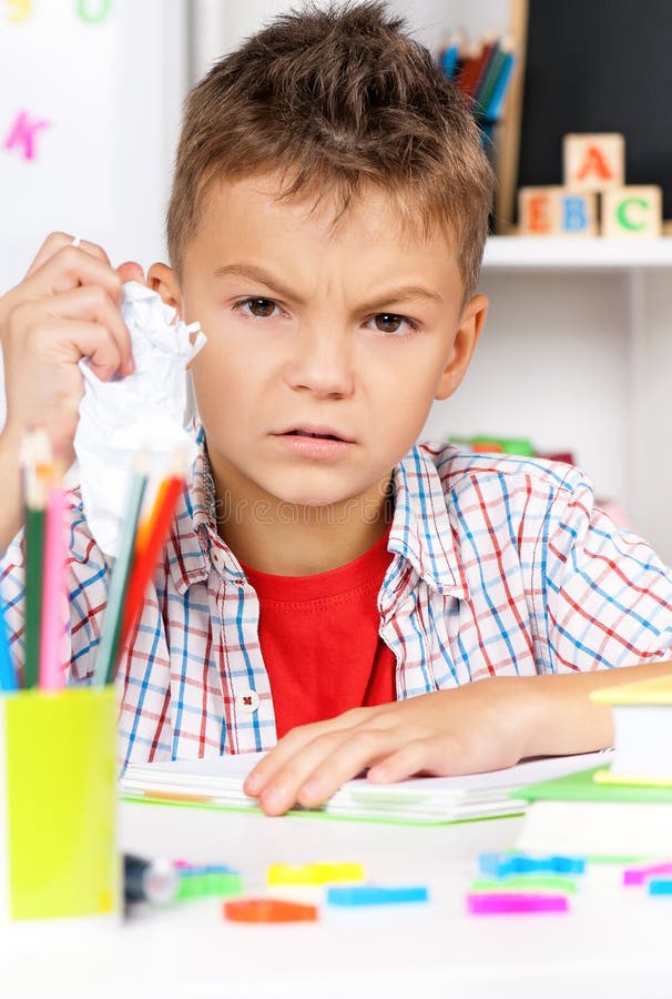 Boy doing homework stock image. Image of knowledge, fury - 44350541