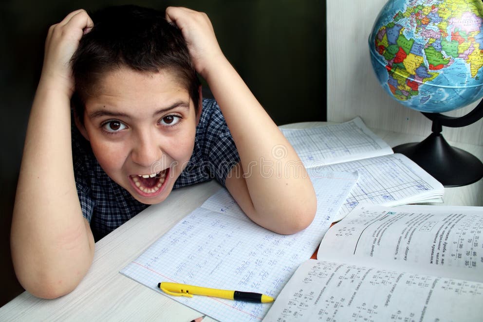 Boy doing math homework stock photo. Image of subject - 52849012