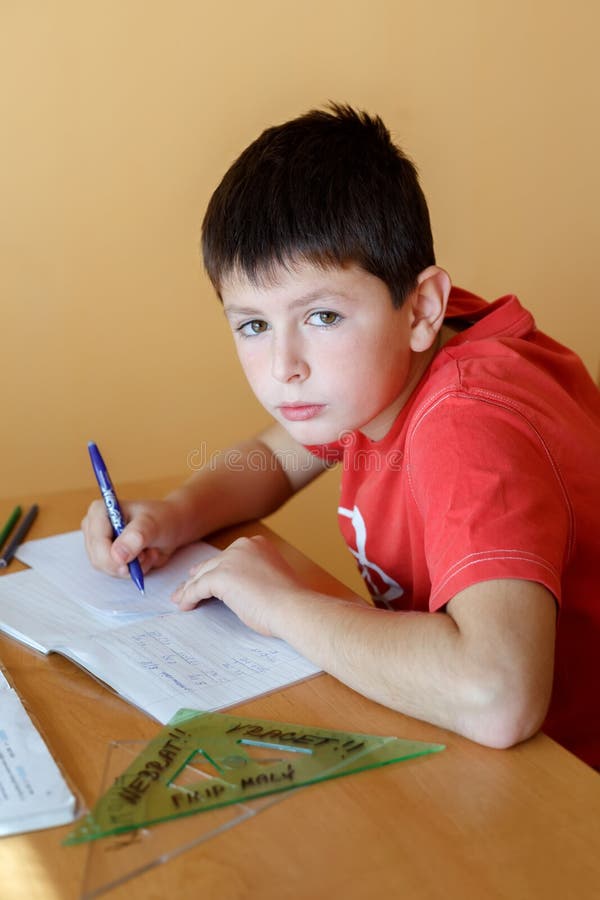 Boy doing school homework stock photo. Image of exercise - 34026696