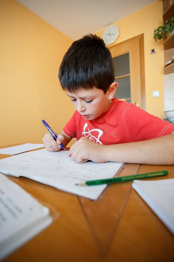 Boy doing school homework stock image. Image of expression - 34026699