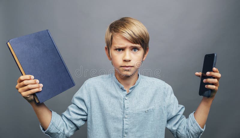 Boy Doubting Book or Smartphone Stock Photo - Image of childhood ...