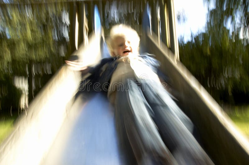 Boy down the slide stock photo. Image of child, silver - 440898