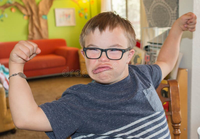 Boy with Downs Syndrome Flexing His Muscles Stock Photo - Image of life ...