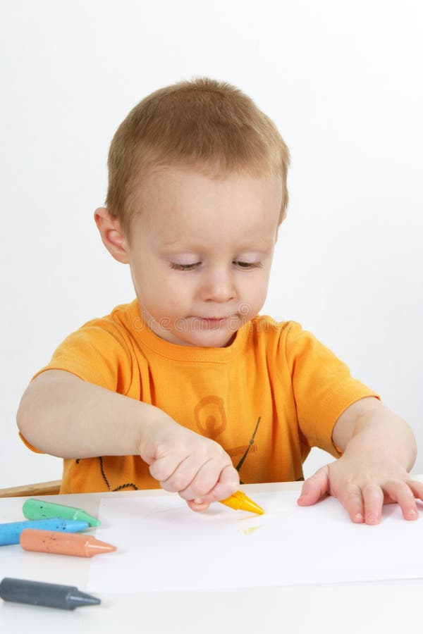 Boy drawing with crayons stock photo. Image of addiction - 34416556