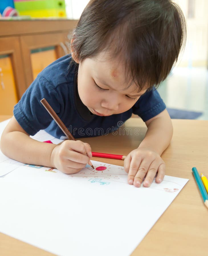 Young boy drawing at home stock photo. Image of young - 66072394