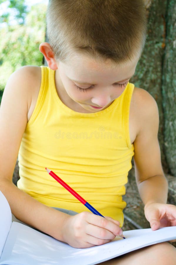 Boy drawing stock photo. Image of pencil, schoolchildren - 29935402