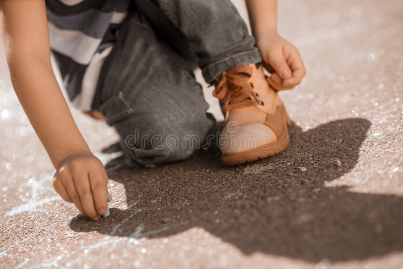 Boy Drawing Something on the Ground Stock Image - Image of igen ...