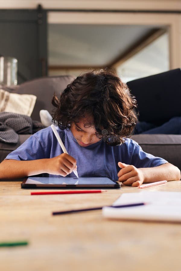 Boy Drawing on Tablet and Concentrating Stock Photo - Image of homework ...