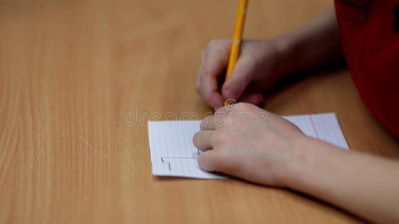 Boy Draws Curve by Pencil on Squared Paper at Stock Video - Video of ...