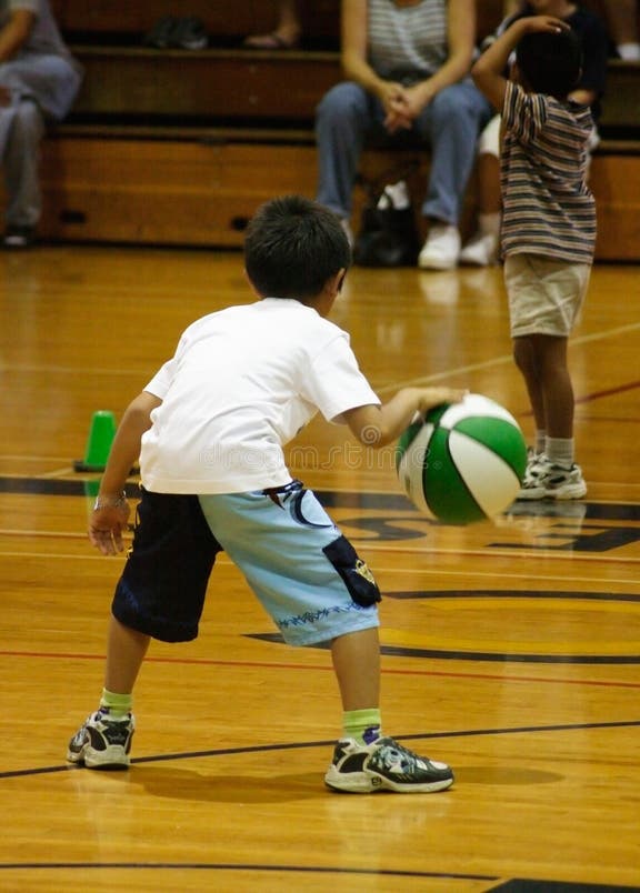Boy dribbling basketball stock photo. Image of bounce, stance - 187582