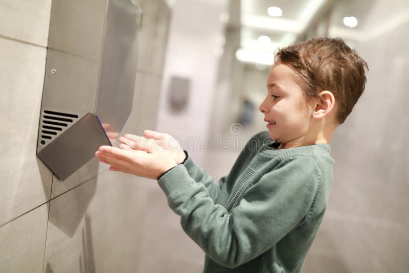 Child Drying His Hands with Dryer Stock Image - Image of object ...