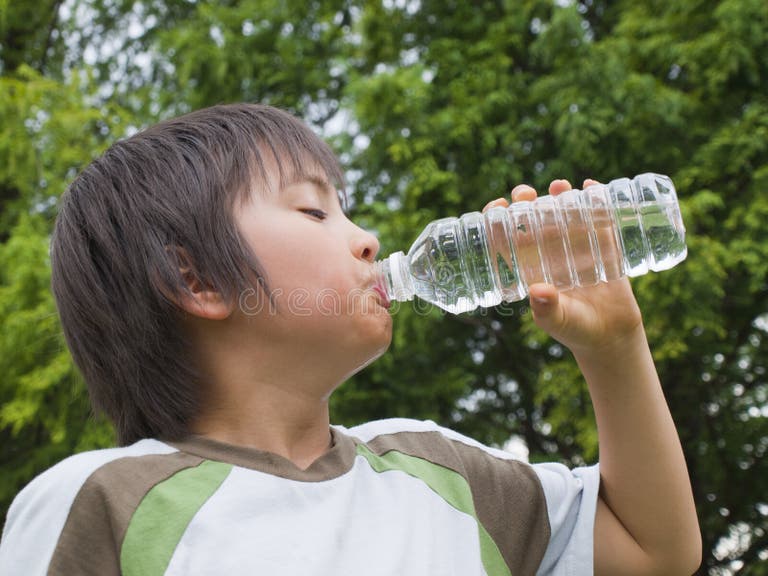 Boy drinking mineral water stock image. Image of child - 23436159