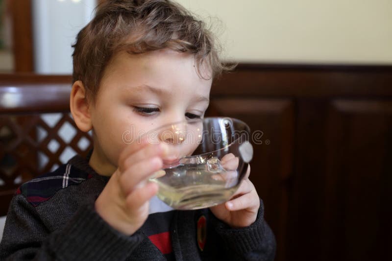 Boy drinking mint tea stock photo. Image of innocence - 41907302