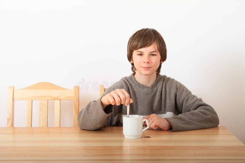 Boy drinking tea stock image. Image of morning, smiling - 48809049