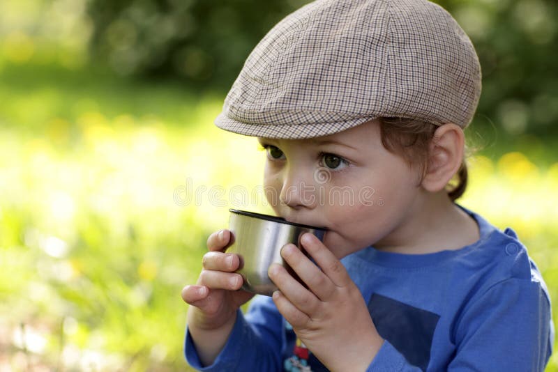 Boy drinking tea outdoor stock image. Image of care, heat - 42367903
