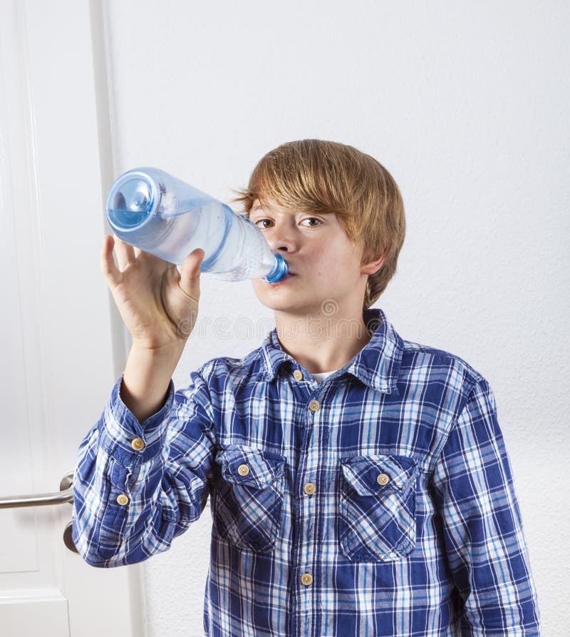 Boy Drinking Water Out of a Bottle Stock Photo - Image of brown, glass ...