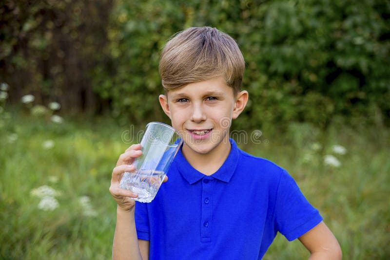Boy drinking water stock image. Image of friendship - 105252609
