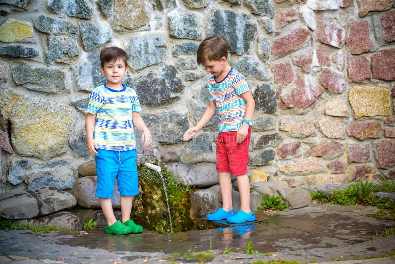 The Boy Drinks Cold Water Outdoors from the Pipe Stock Image - Image of ...