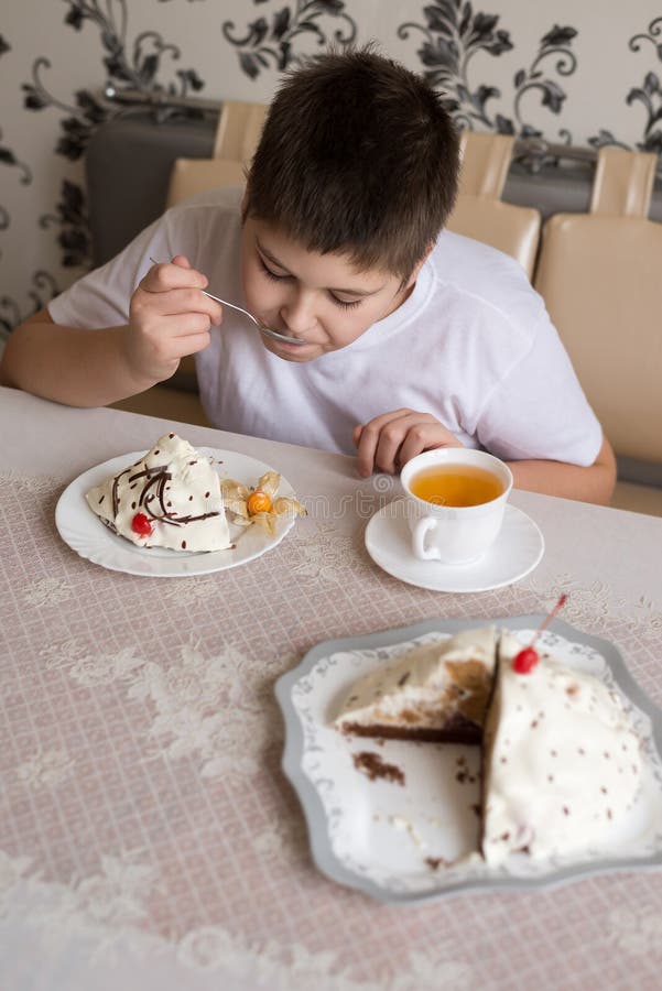 Boy Drinks Tea Cake Table Stock Photos - Free & Royalty-Free Stock ...
