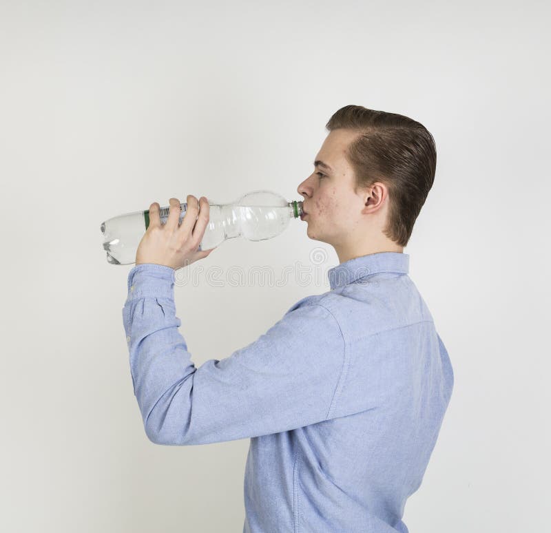 Sweating Boy is Drinking Water Out of a Bottle Stock Image - Image of ...