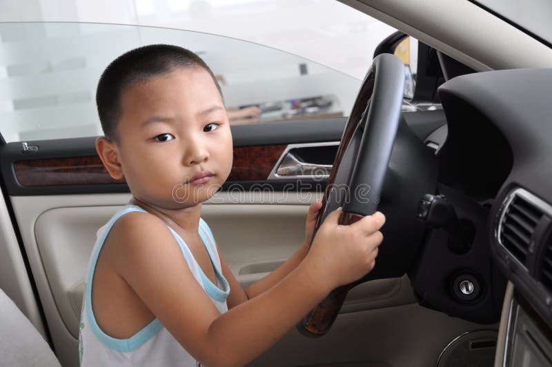 Boy driving stock image. Image of chinese, vehicle, child - 15597929