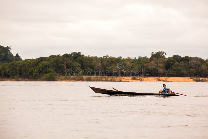 Boy Driving Boat on Amazon River Editorial Stock Photo - Image of water ...