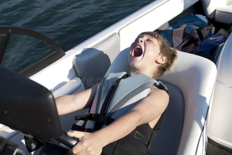 Boy Driving Ski Boat Fast stock image. Image of drive - 6525989