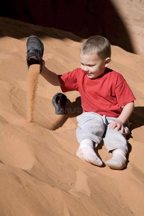 Boy Dumping Sand Out Shoes Stock Photos - Free & Royalty-Free Stock ...