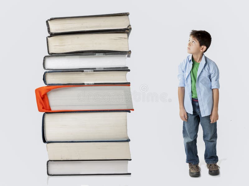 Boy Dwarfed by Stack of Books. Stock Image - Image of youth, young ...
