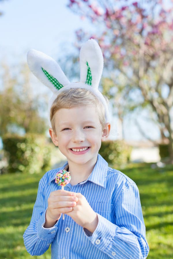 Boy at easter time stock photo. Image of painted, flower - 50675444