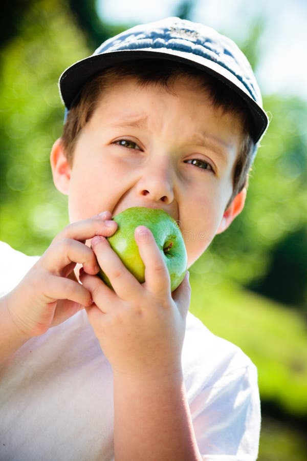 Boy eating an apple stock image. Image of child, young - 30755065