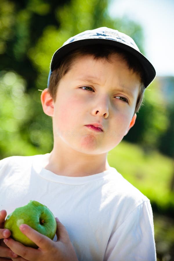 Boy eating an apple stock image. Image of food, eating - 30755075