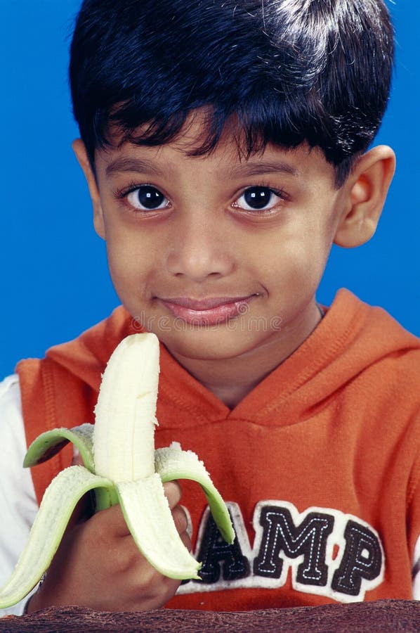 Boy Eating Banana India MR#152 Editorial Photo - Image of shirt ...