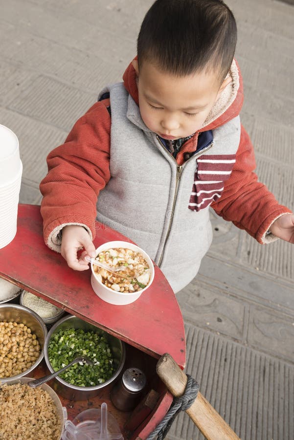Boy Eating Bean Curd Pudding Stock Photo - Image of bean, outdoor: 49211540