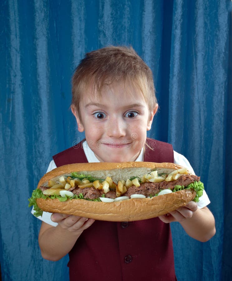 Boy eating big sandwiches stock photo. Image of caucasian - 46263180