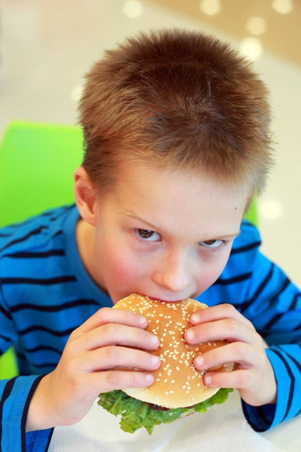 11+ Boy eating burger Free Stock Photos - StockFreeImages