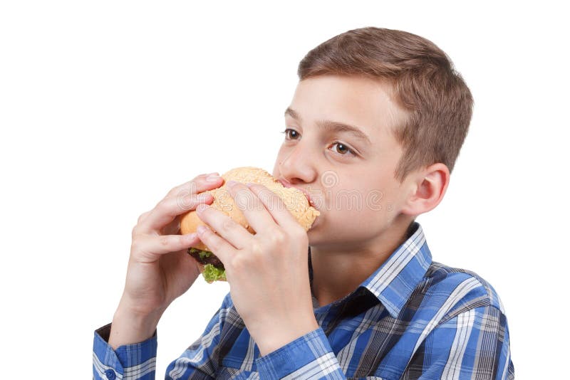 Boy eating a burger stock photo. Image of lettuce, fastfood - 57579932