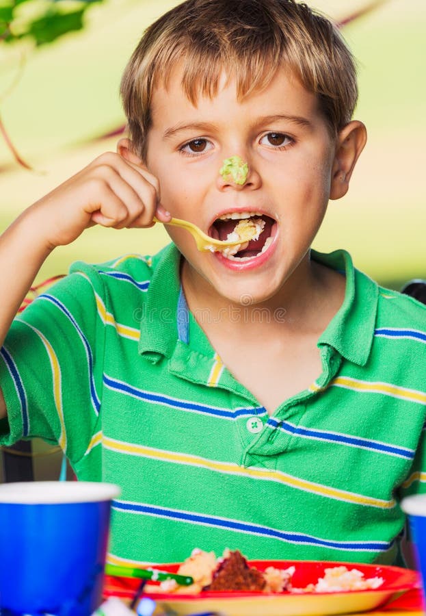 Boy Eating Cake stock image. Image of lifestyle, adolescent - 33587875
