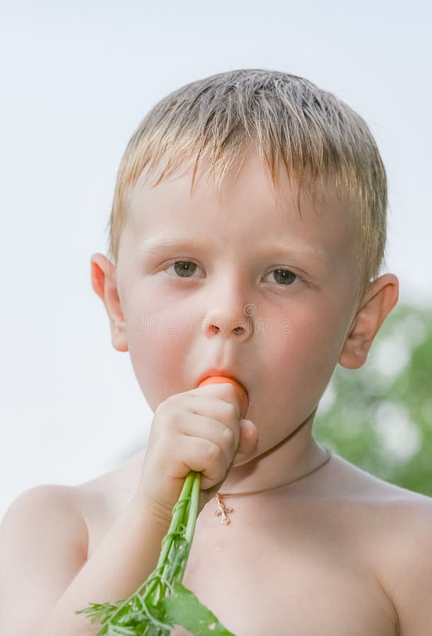 Boy eating carrot stock image. Image of portrait, person - 74909121