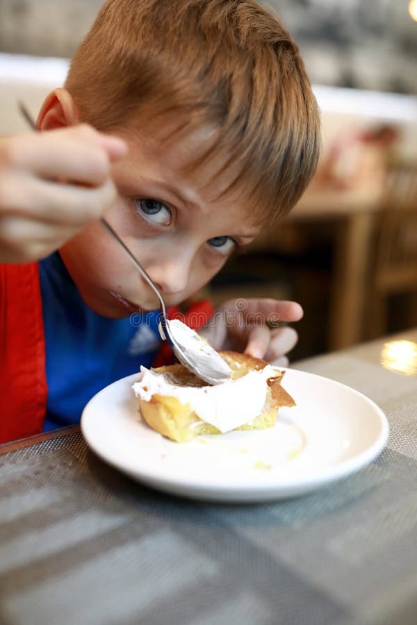 Boy Eating Cheesecake with Sour Cream Stock Image - Image of cake ...
