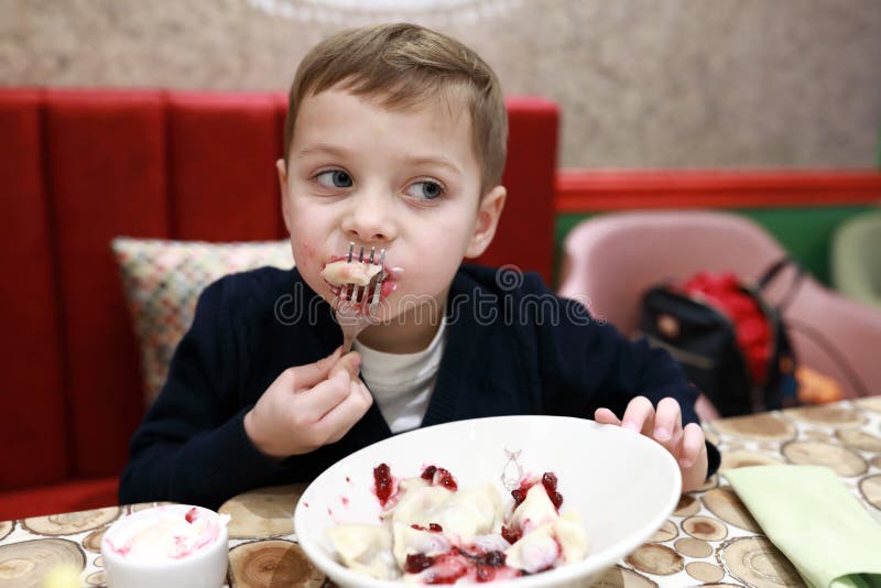 Boy Eating Cherry Dumplings Stock Photo - Image of appetite, healthy ...