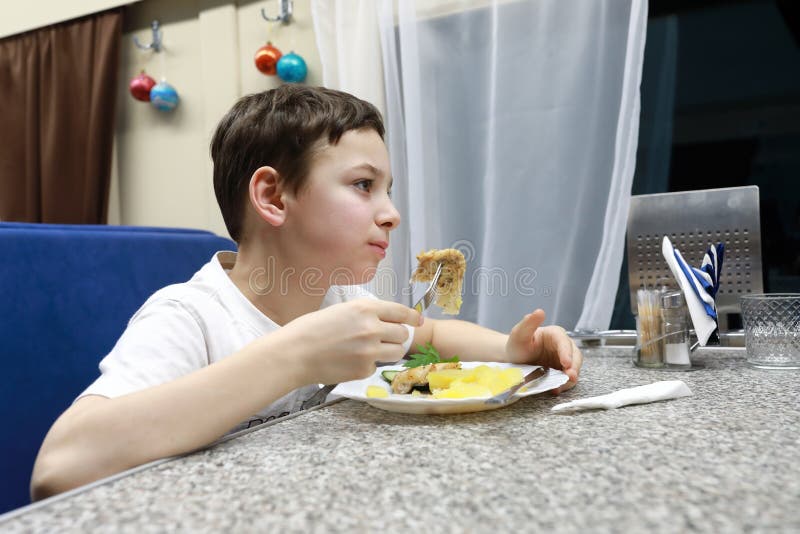 Boy Eating Chicken Steak with Boiled Potatoes Stock Photo - Image of ...