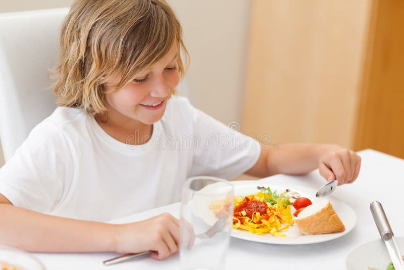 Boy eating dinner stock image. Image of celebrating, meals - 22440441