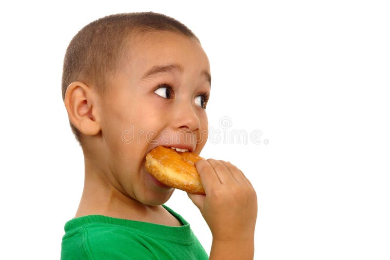 Boy eating a donut stock photo. Image of food, green, devour - 3855560